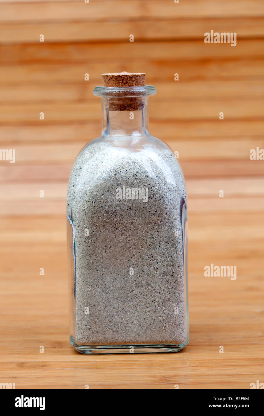 Glass bottle filled with sand from the beach Stock Photo - Alamy