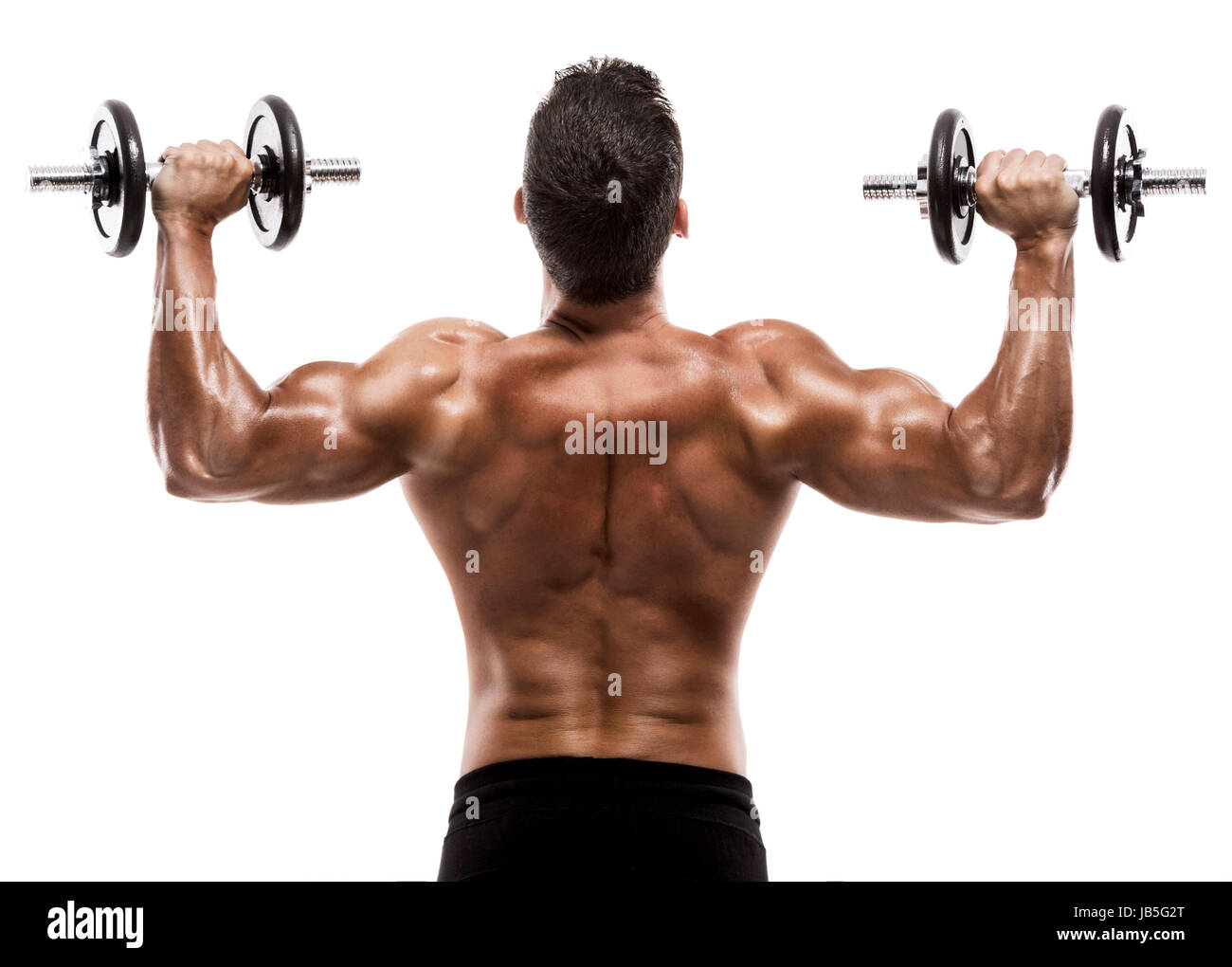 Muscle man in studio lifting weights, isolated over a white background ...