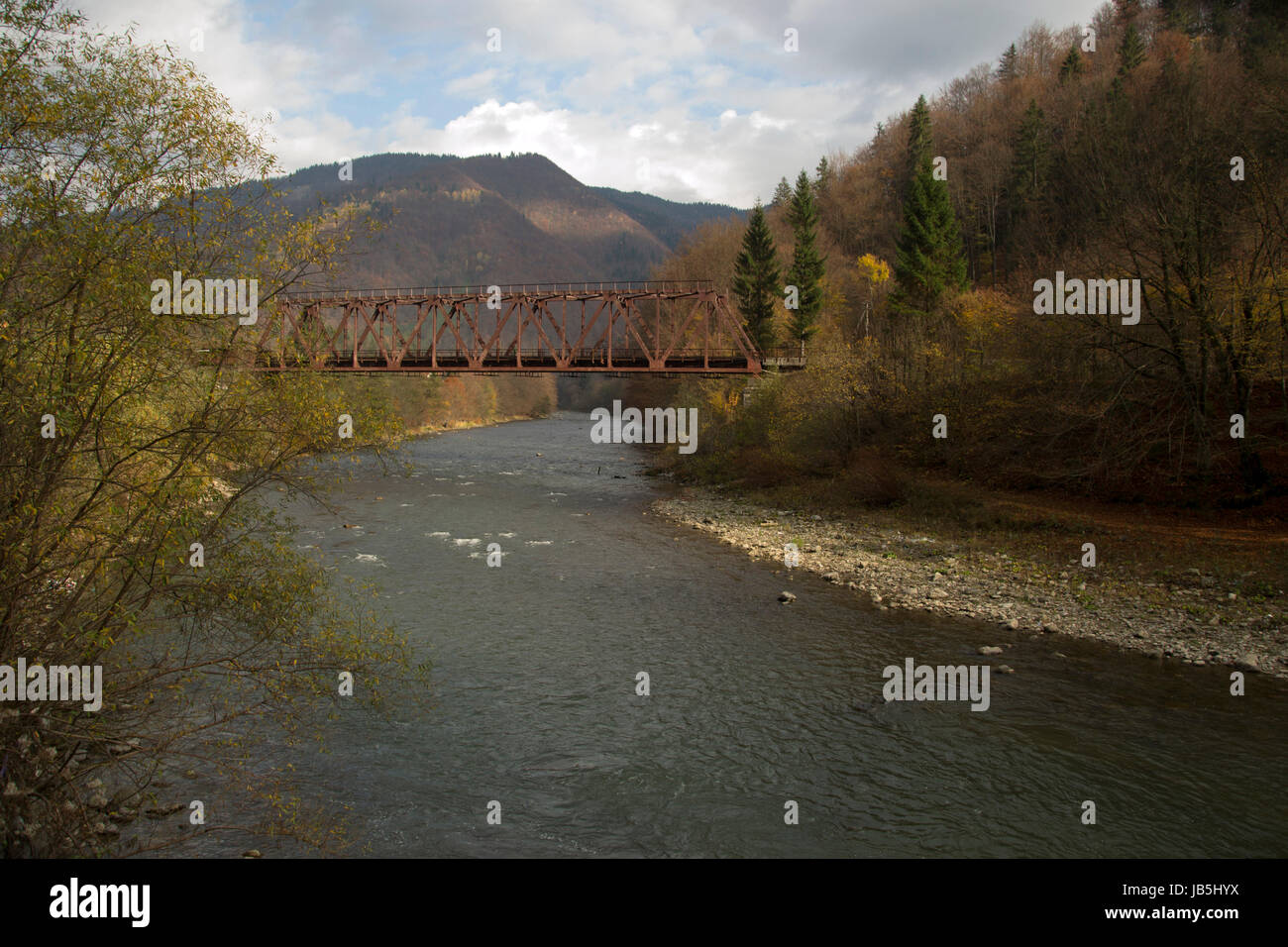Metal bridge over the river among the mountains Stock Photo - Alamy