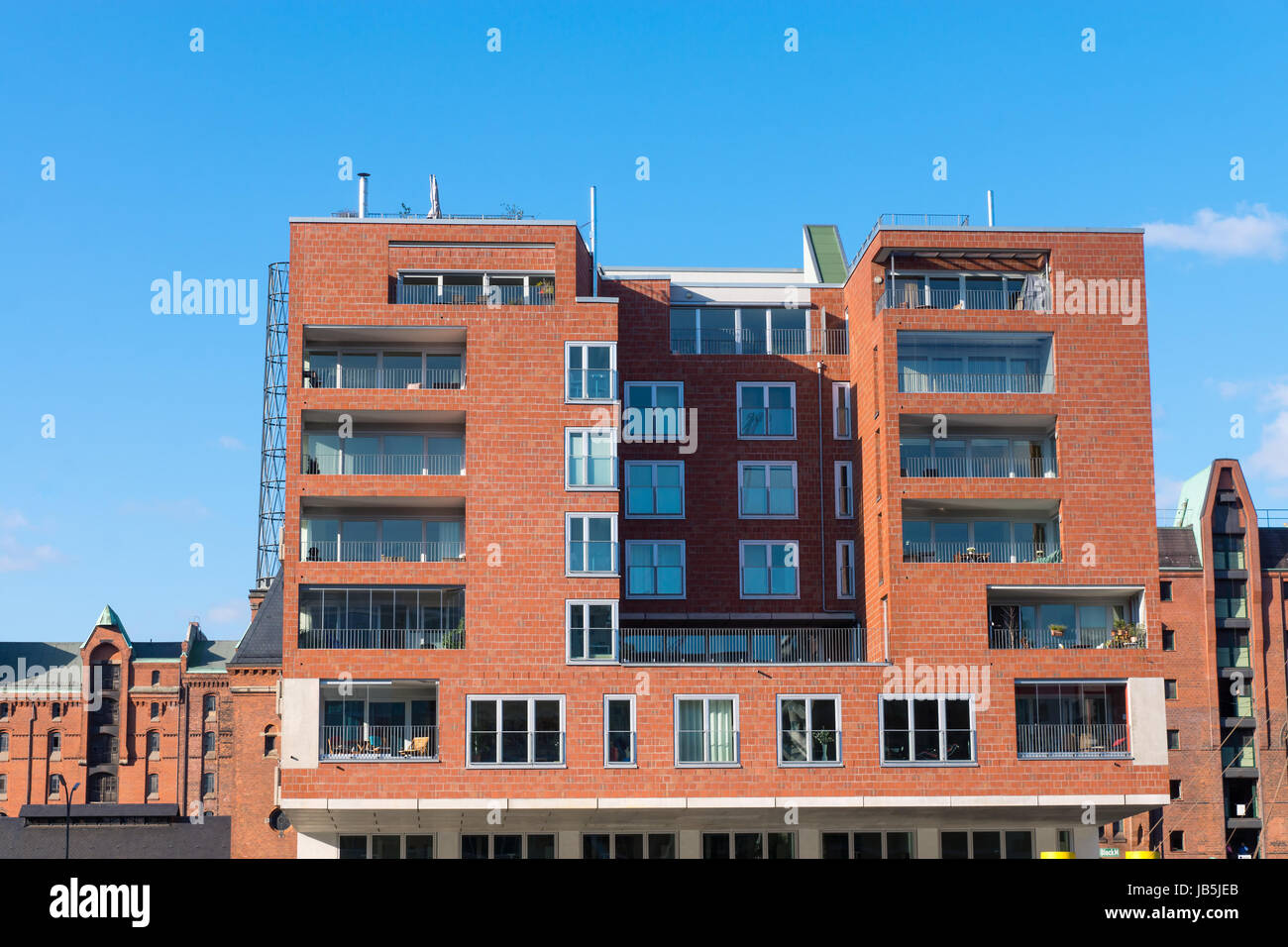 modern red apartment house Stock Photo - Alamy