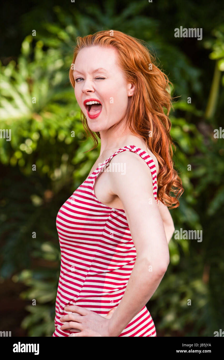 Pretty brunette caucasian danish woman winking Stock Photo - Alamy