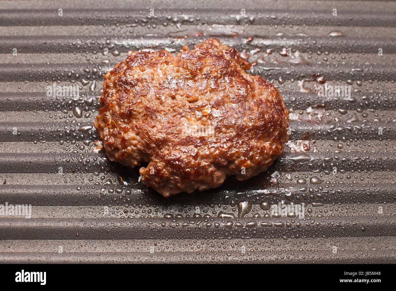 Close up picture of a fried hamburger meat Stock Photo - Alamy