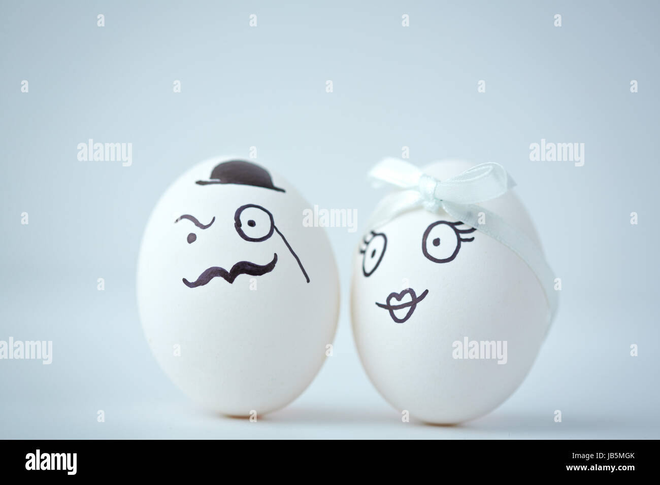 Two Easter eggs stylized as lady and gentleman Stock Photo - Alamy