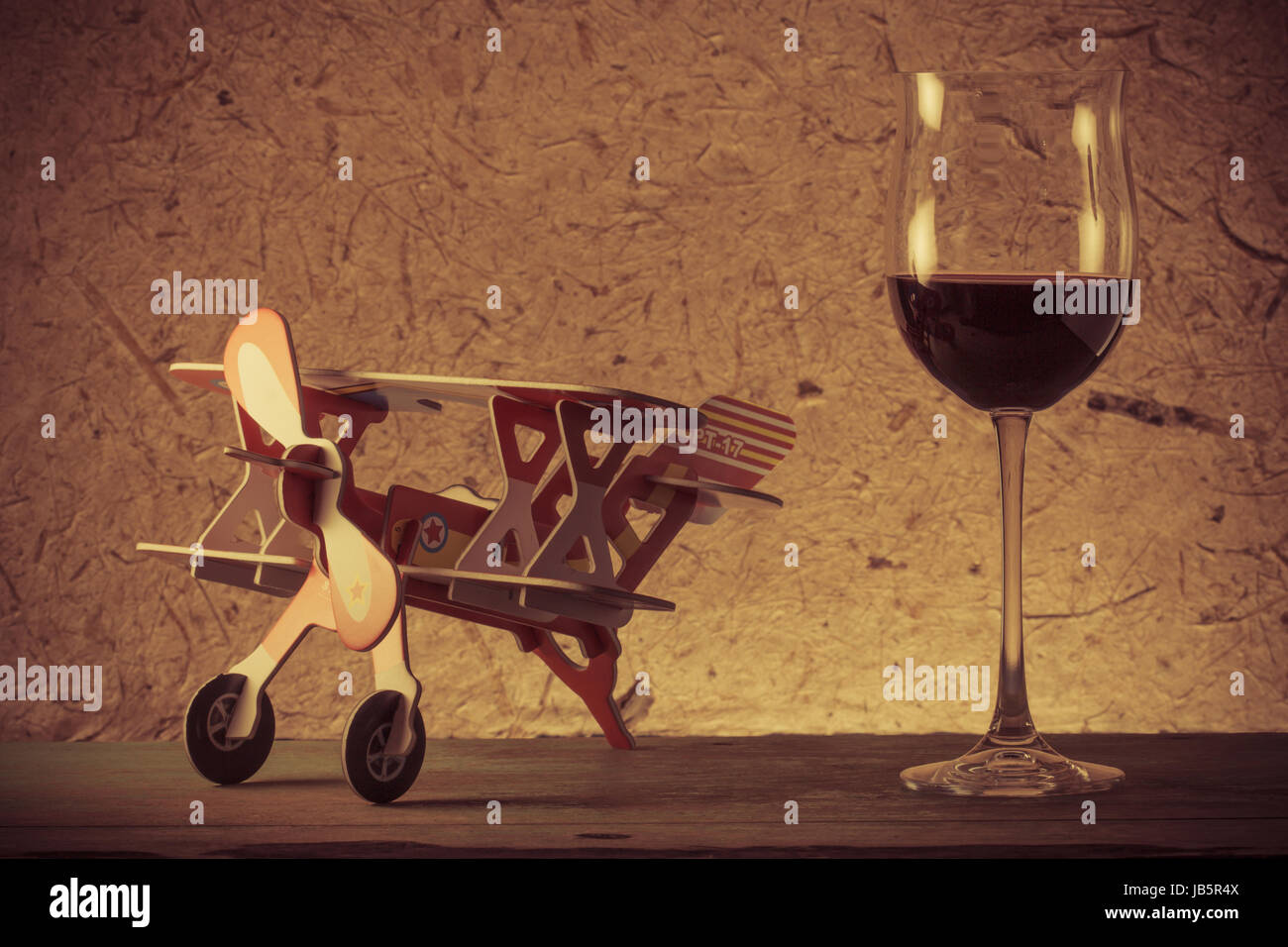 red wine and glass on a vintage old paper background Stock Photo - Alamy
