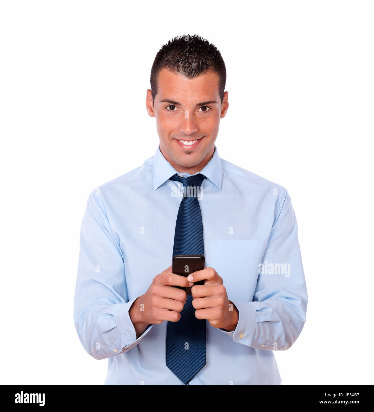 Portrait of a handsome young man on blue shirt and tie texting with his ...