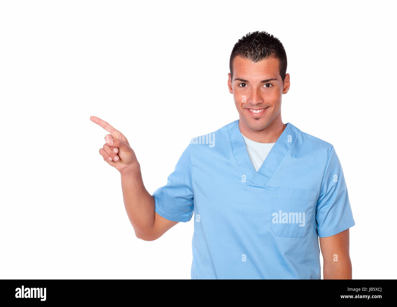 Portrait of a charismatic nurse guy on blue uniform pointing to his ...