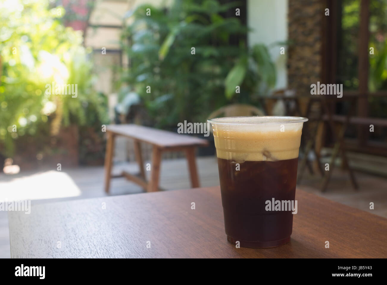Sparkling Nitro Cold Brew infused Coffee on wood table outdoor coffee ...