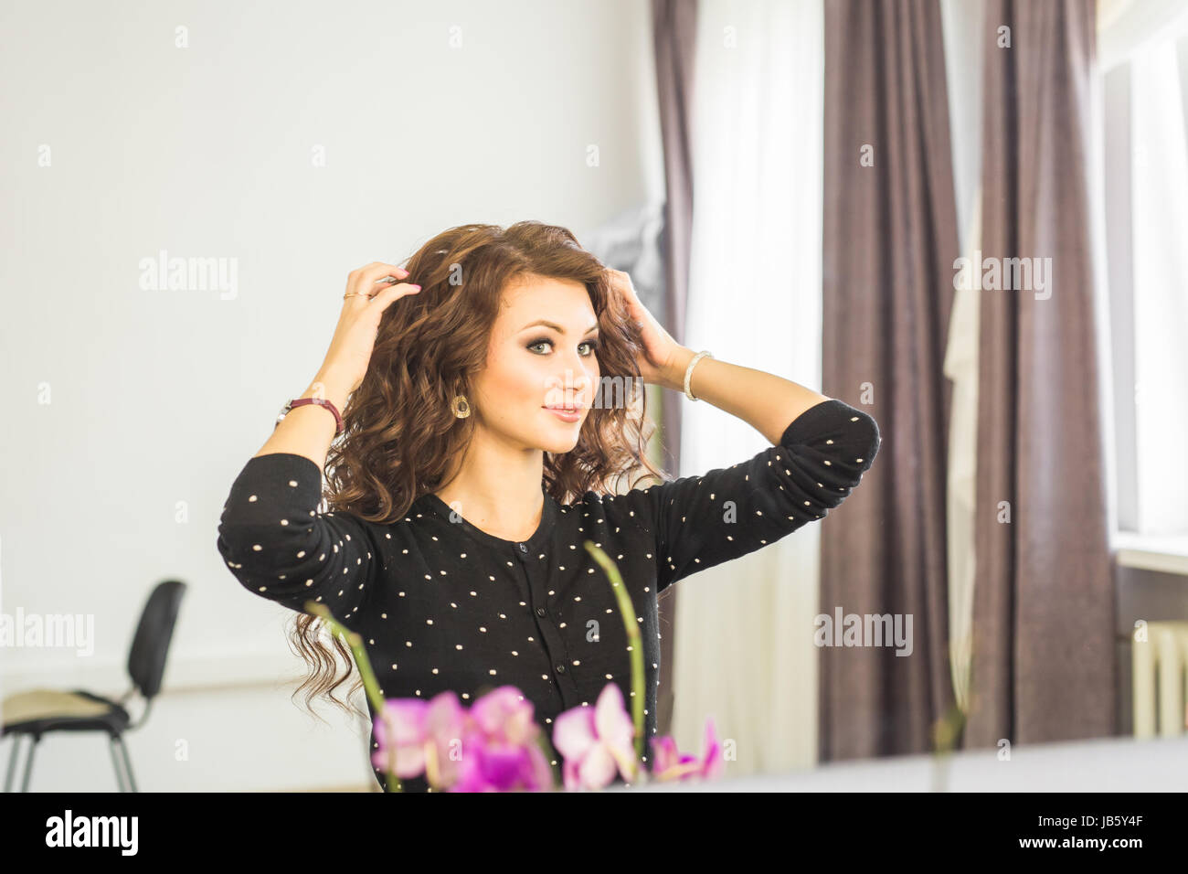 Beautiful woman with lush wavy hair Stock Photo - Alamy