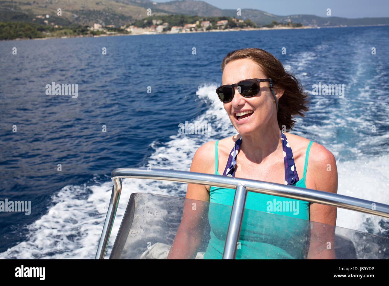 Female driving boat hi-res stock photography and images - Alamy