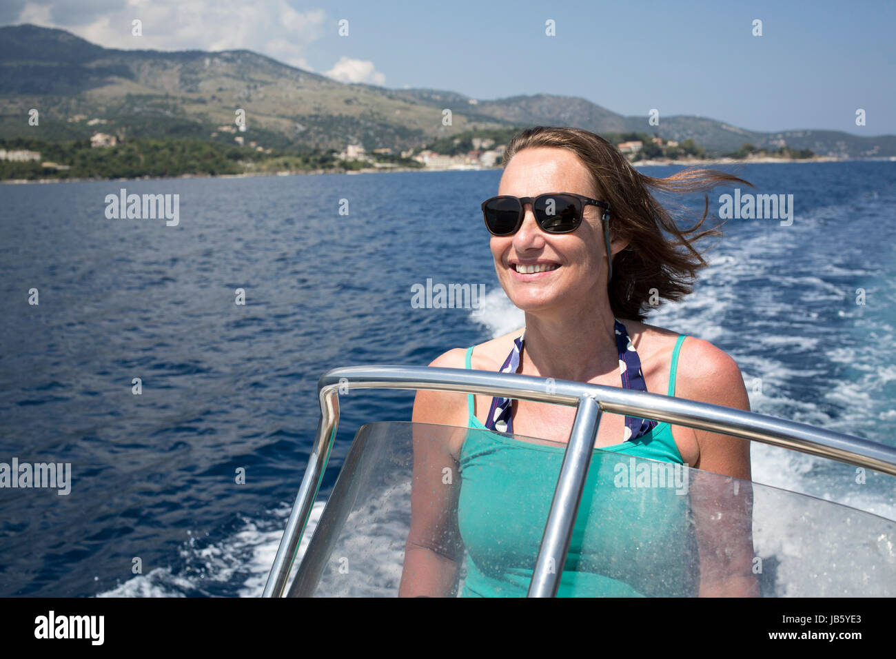 Female driving boat hi-res stock photography and images - Alamy