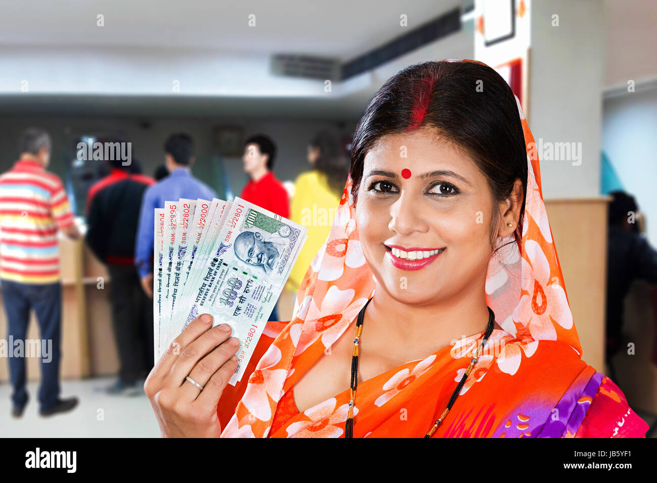 Smiling indian rural female showing money rupees hi-res stock ...