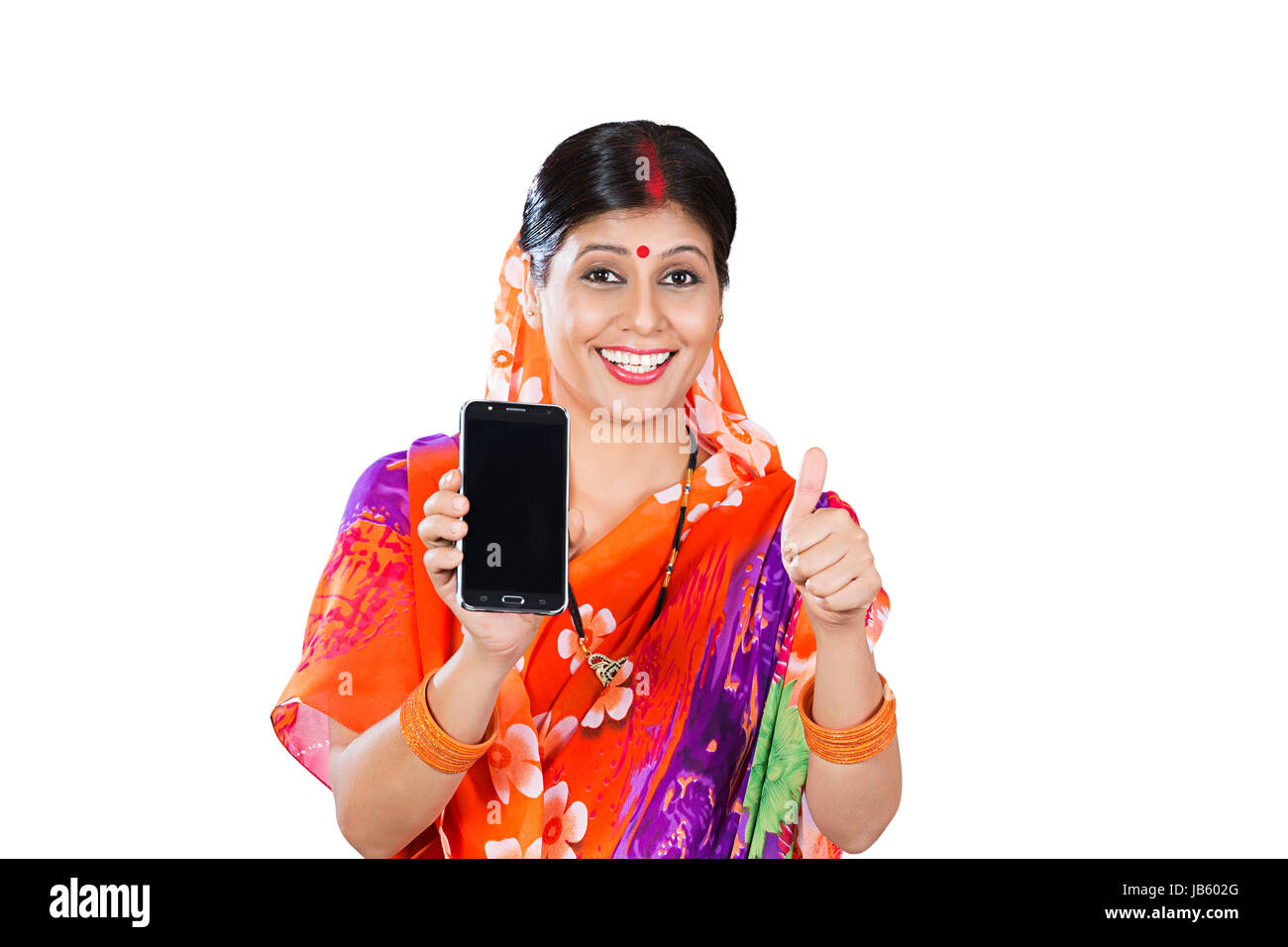 1 Indian Rural woman holding mobile phone and showing thumbs up Happy ...