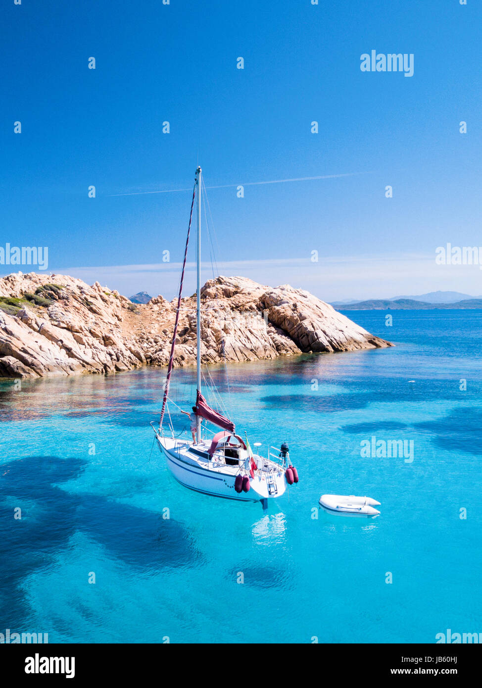 Aerial view of a sail boat in front of Mortorio island in Sardinia ...