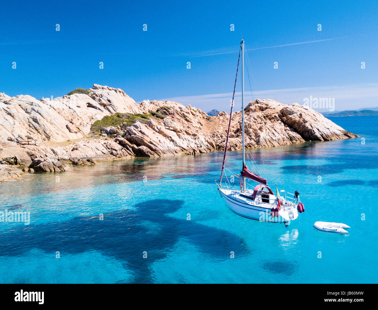 Aerial view of a sail boat in front of Mortorio island in Sardinia ...