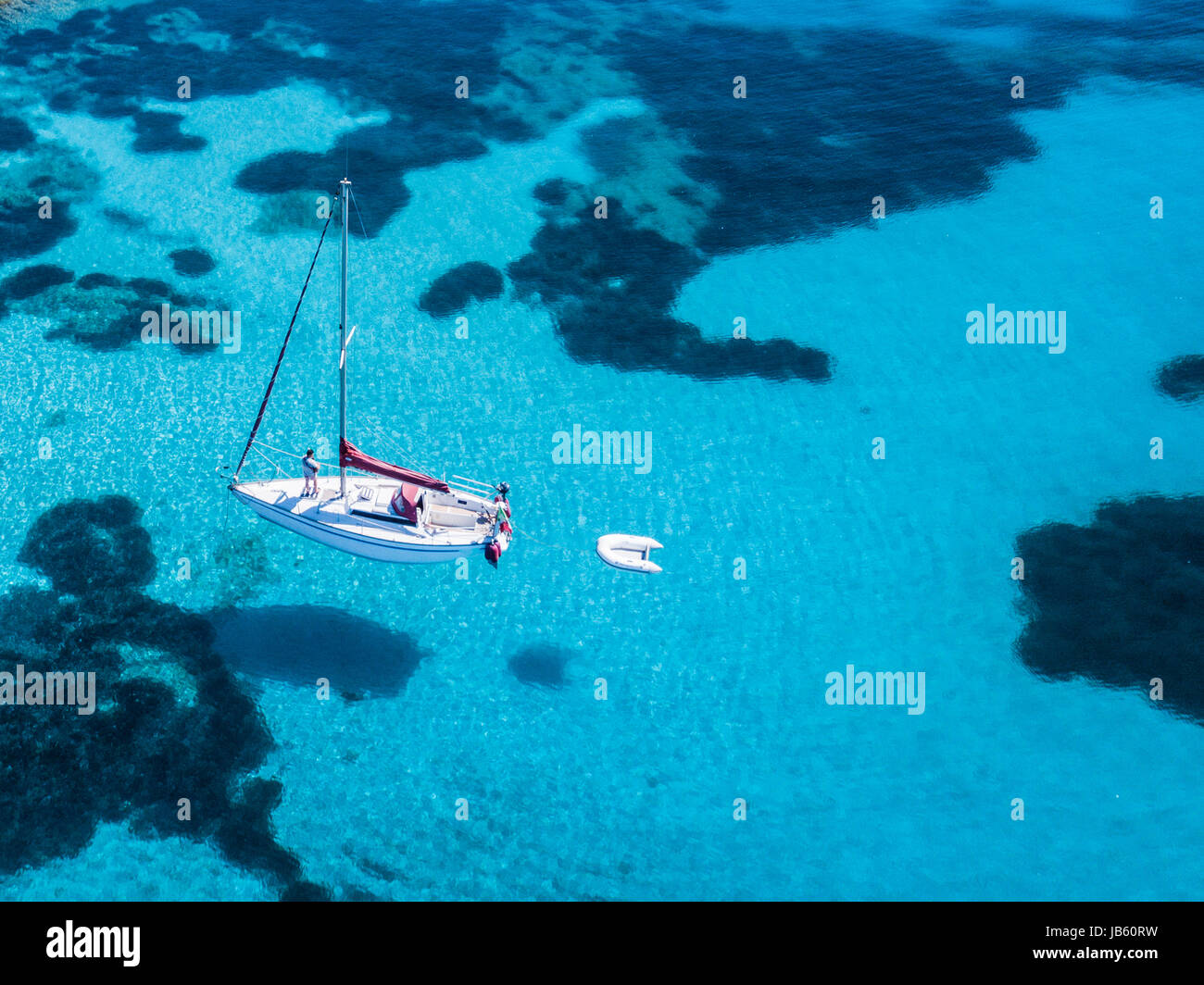 Aerial view of a sail boat in front of Mortorio island in Sardinia ...