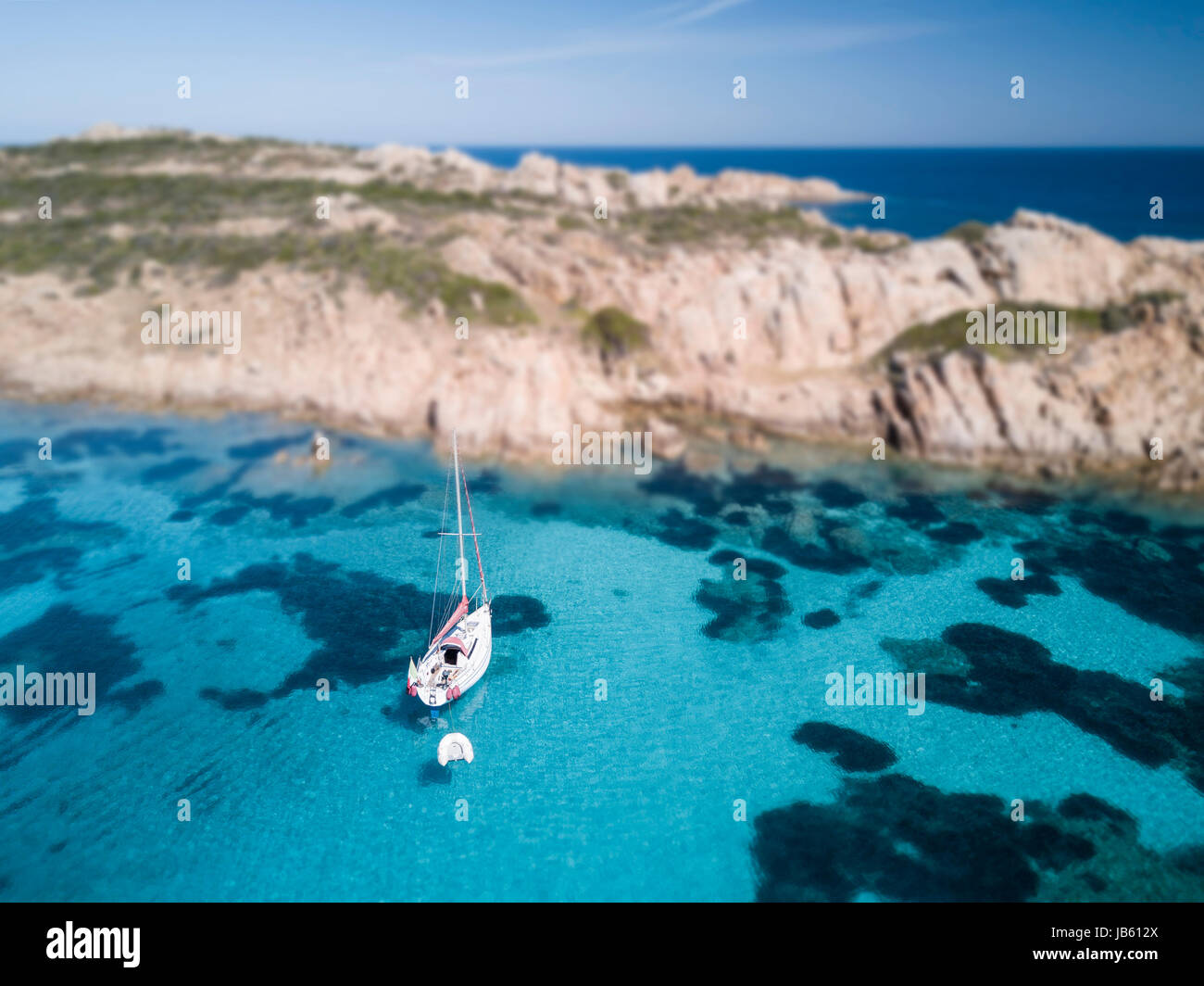 Aerial view of a sail boat in front of Mortorio island in Sardinia ...