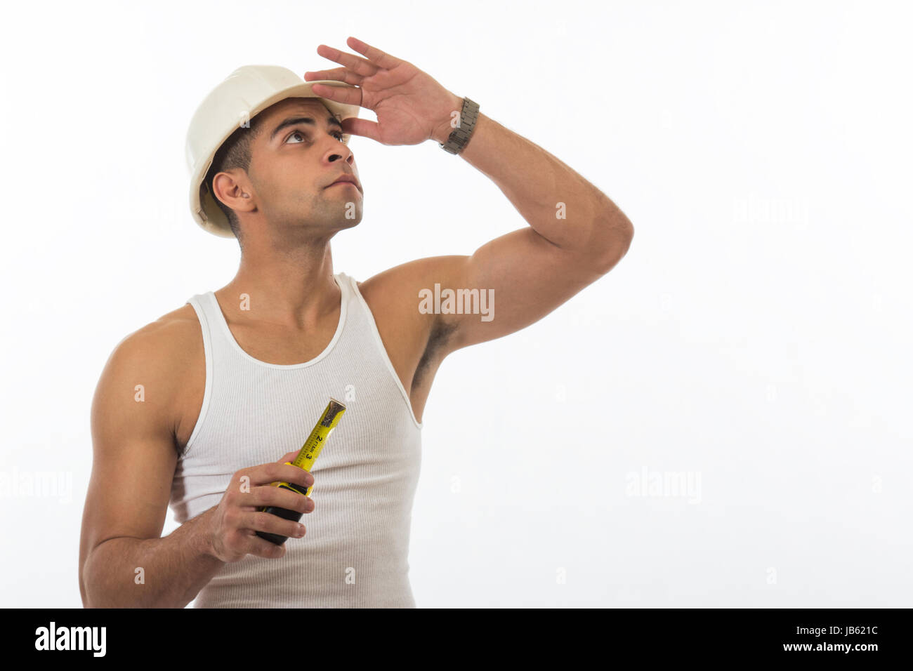 Physically fit attractive hispanic construction worker Stock Photo - Alamy