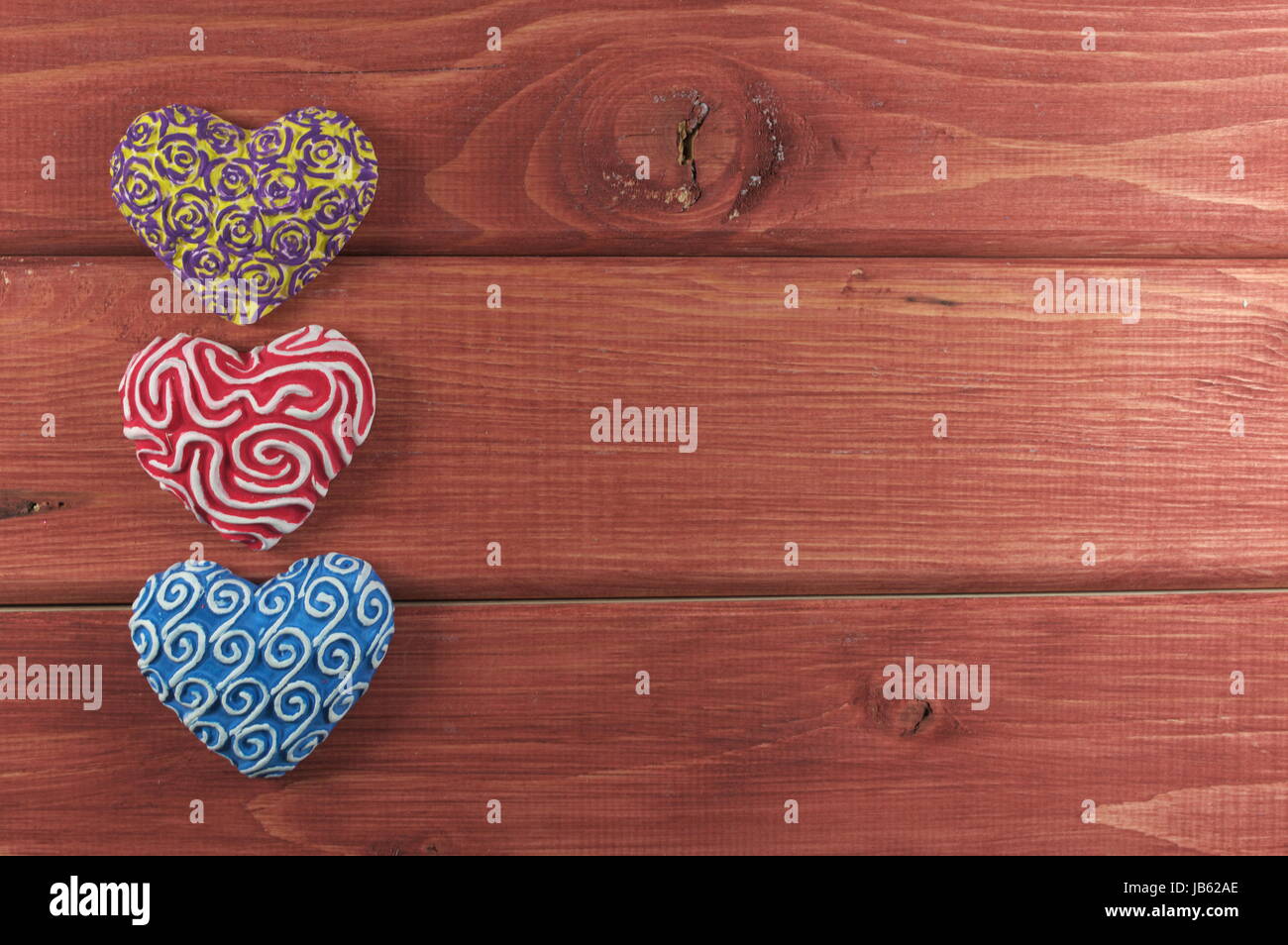 three colored hearts Stock Photo - Alamy