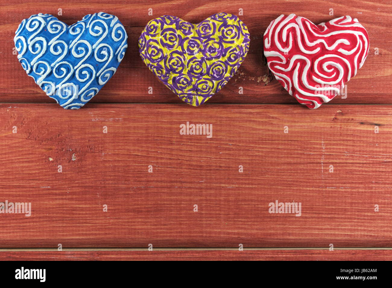 three colored hearts Stock Photo - Alamy