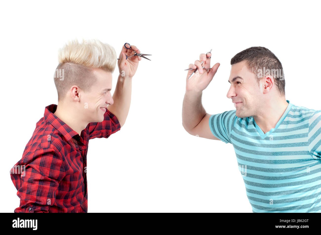 Two men with scissors aiming each other, isolated on white Stock Photo ...
