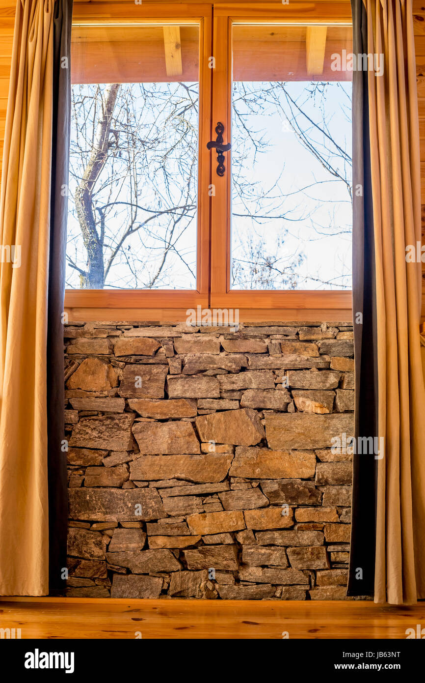 Stone wall interior with window, curtains and tree Stock Photo - Alamy