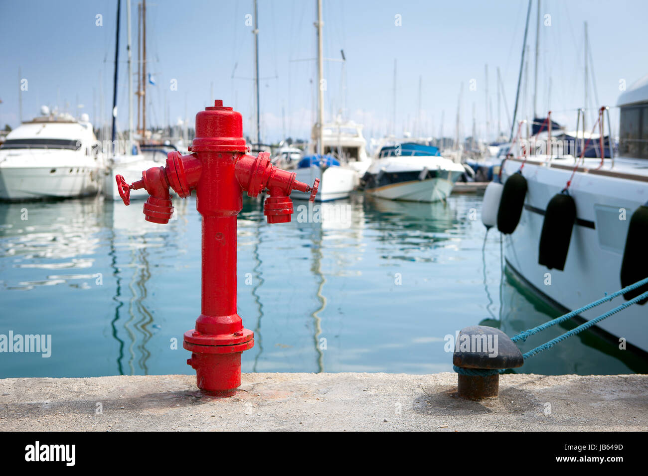Marine fire hydrant on the quay in front of the yachts Stock Photo - Alamy