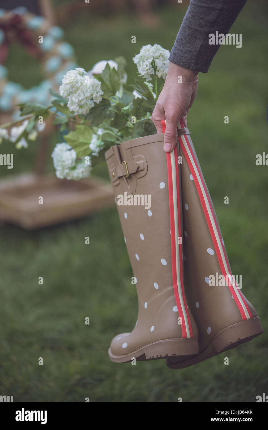 Flowers in Boots Stock Photo - Alamy