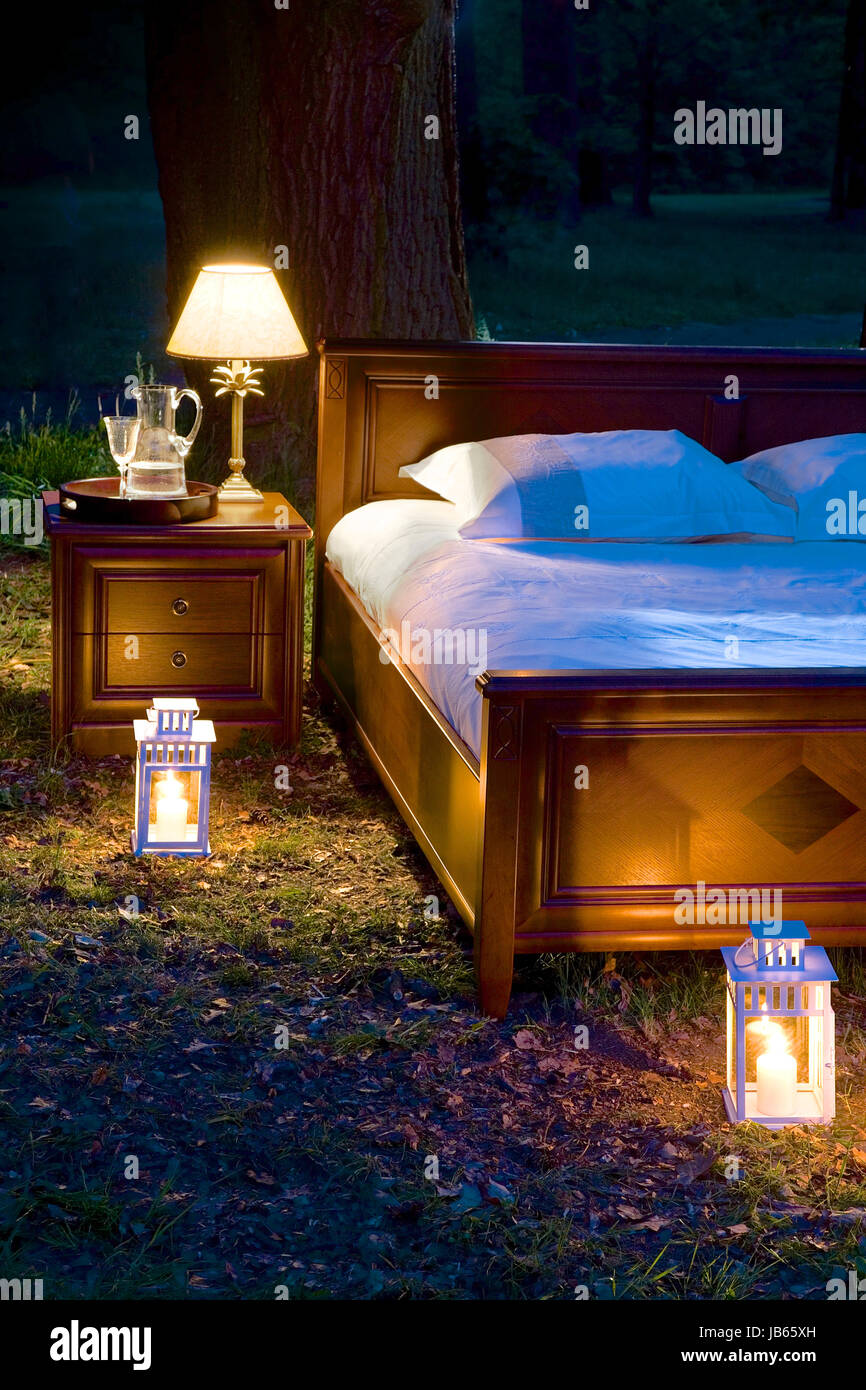 bed in forest - concept of good sleep Stock Photo - Alamy