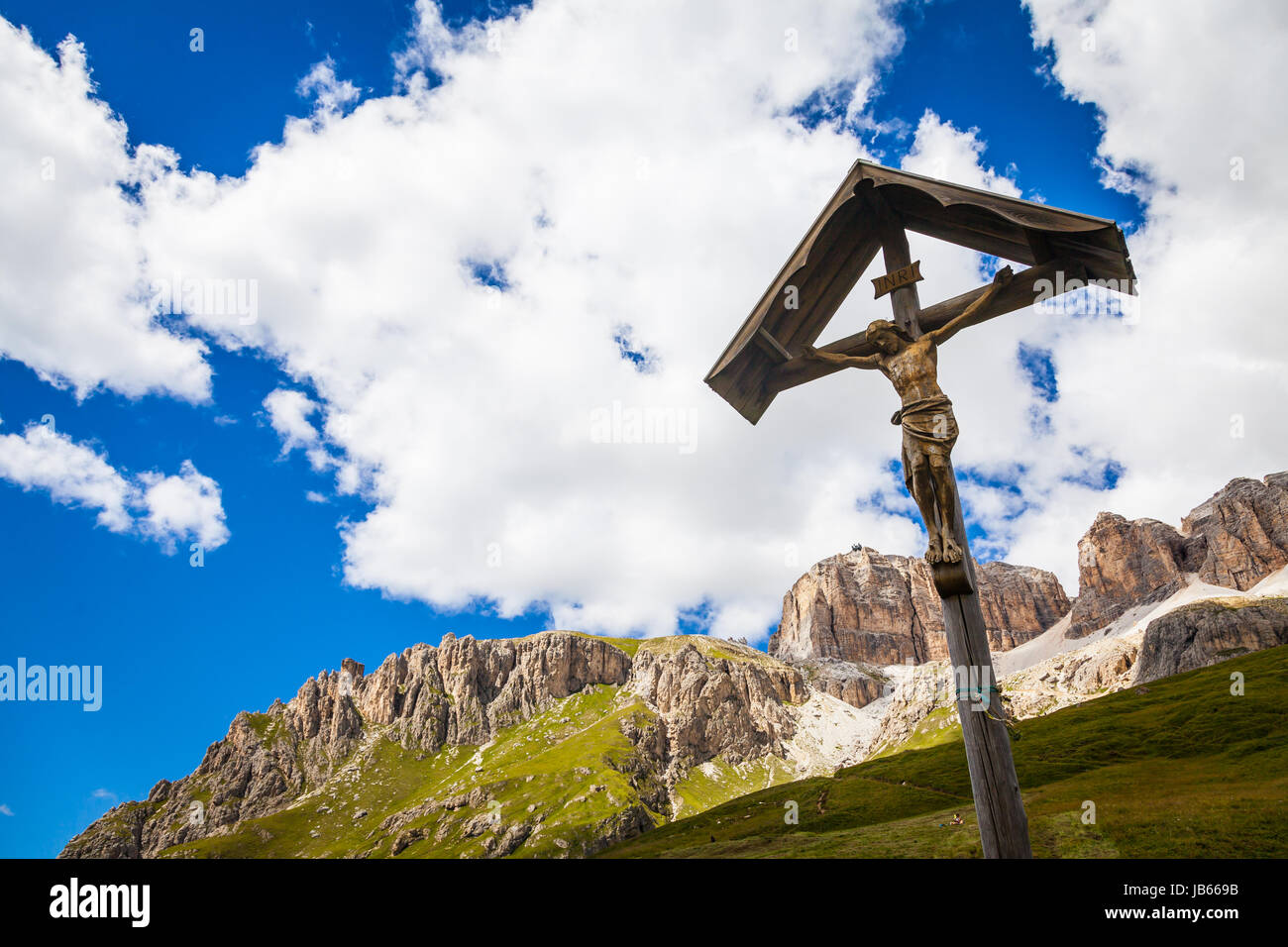 A 100 years old Crucifix, made of wood, tipical of Dolomity Region in ...