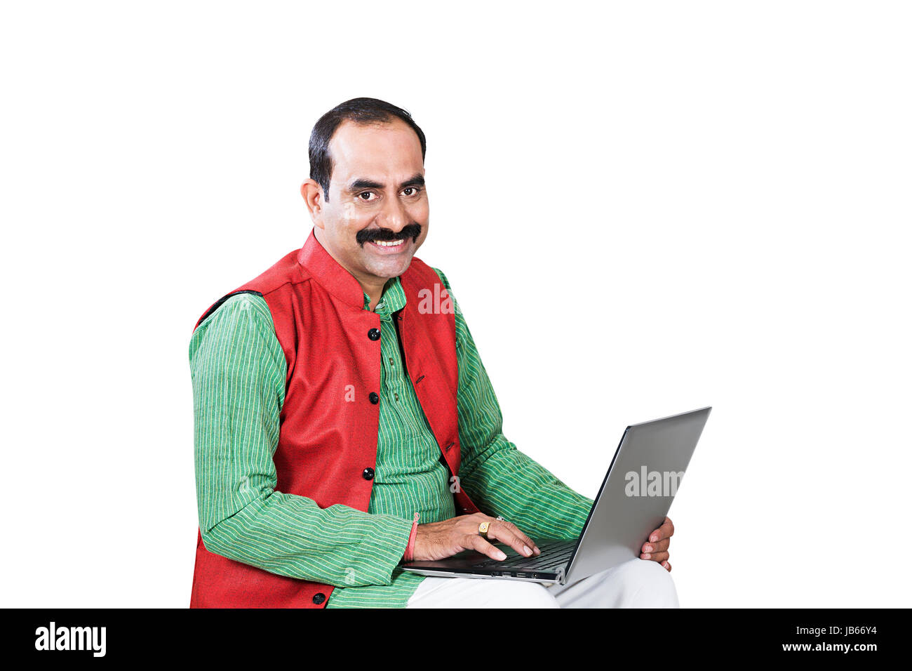 1 Indian Rural Man sitting And Using Laptop Smiling On White background ...