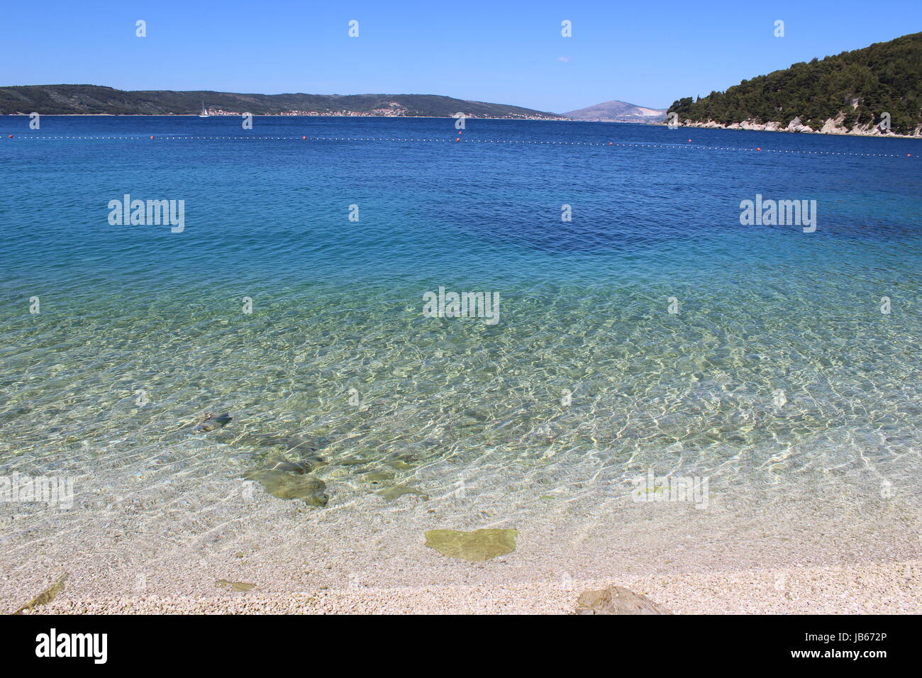 View of clean clear water out to sea from Marjan, near Split Croatia ...