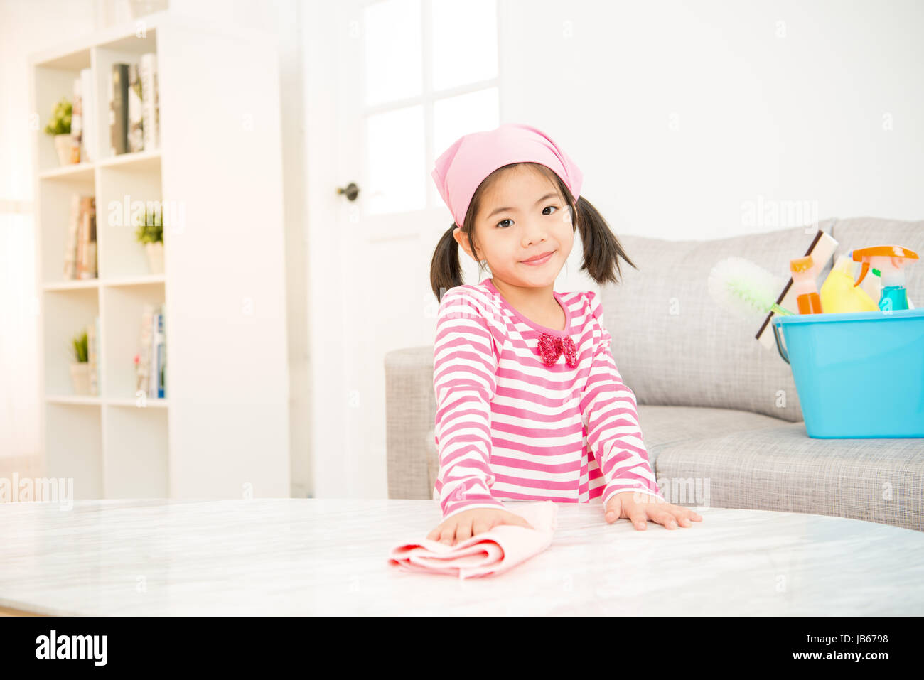 asian chinese cute little girl help make cleaning in the living room at ...