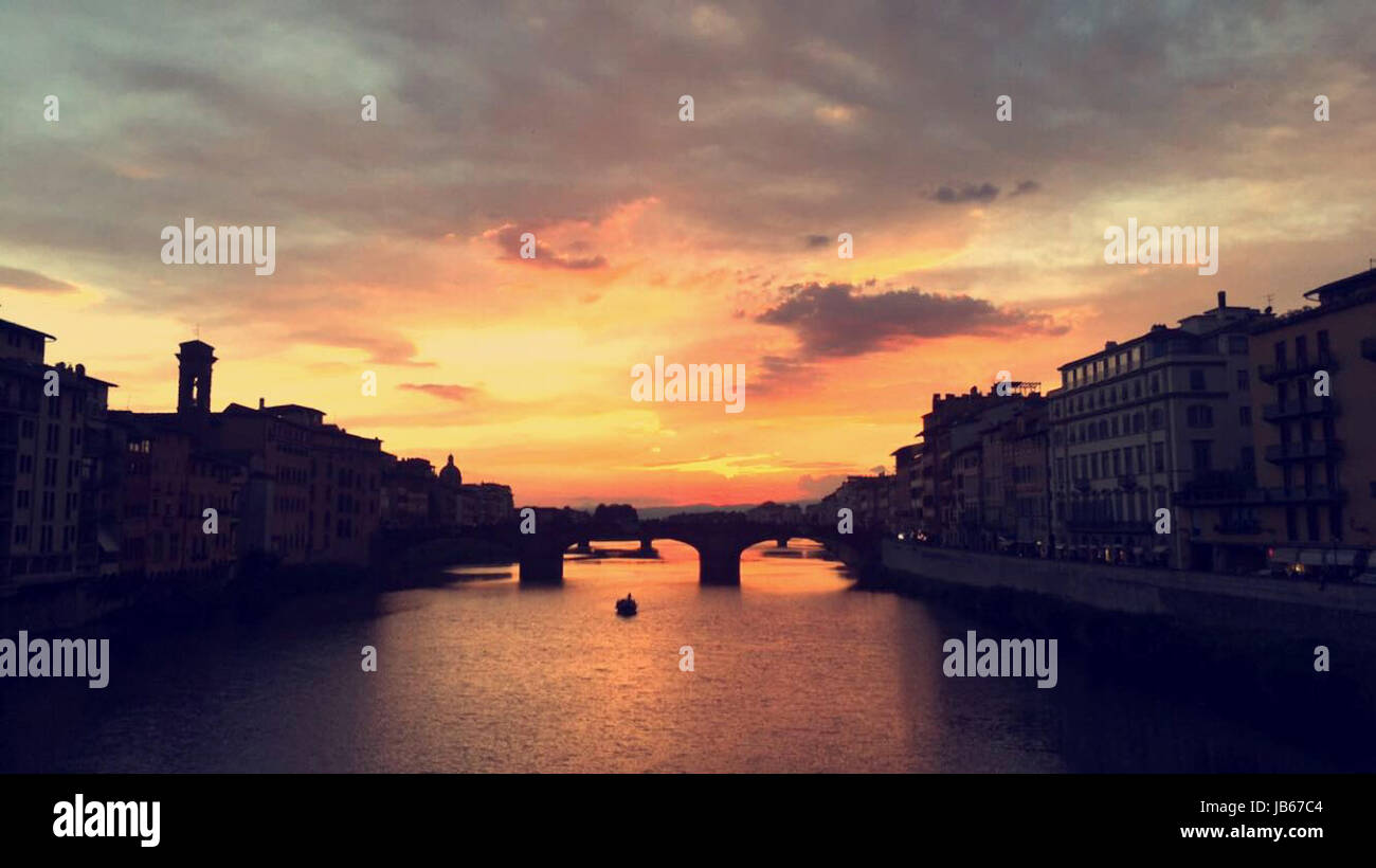 Sunset on the riviera over the bridge with the water reflecting the sky ...