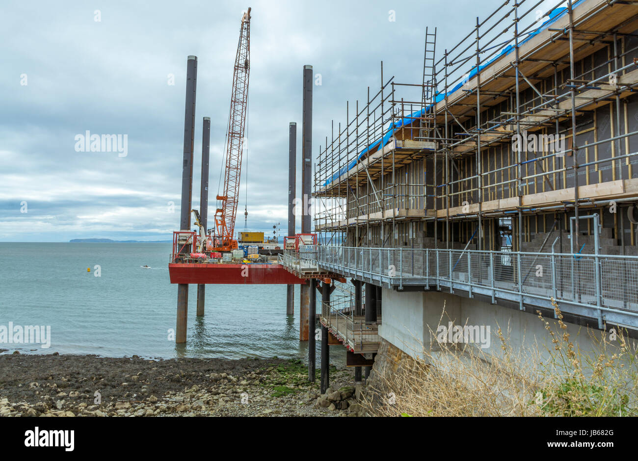 Construction of the new lifeboat house and slipway in progress, taken ...