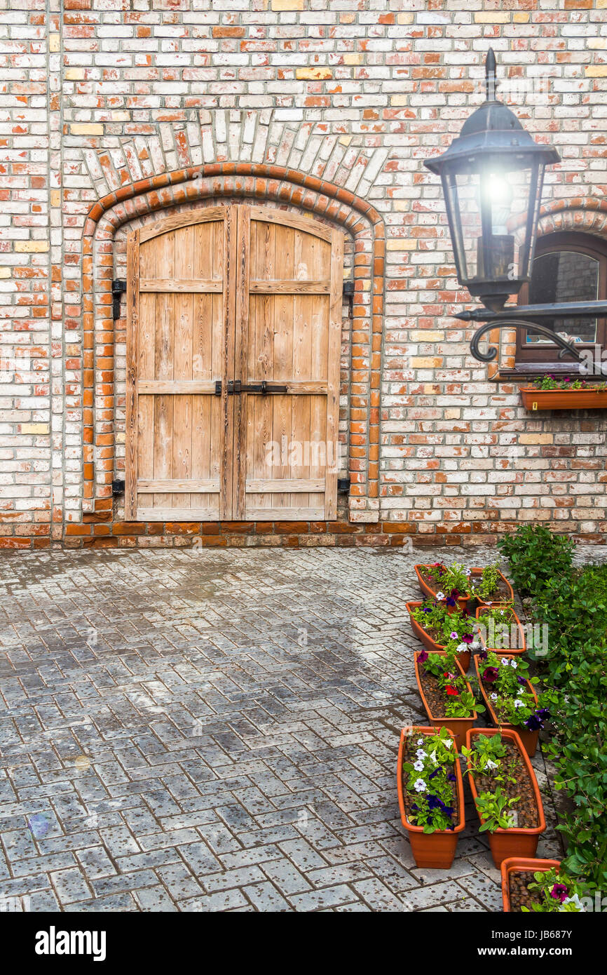 Old wooden door in a brick wall Stock Photo - Alamy