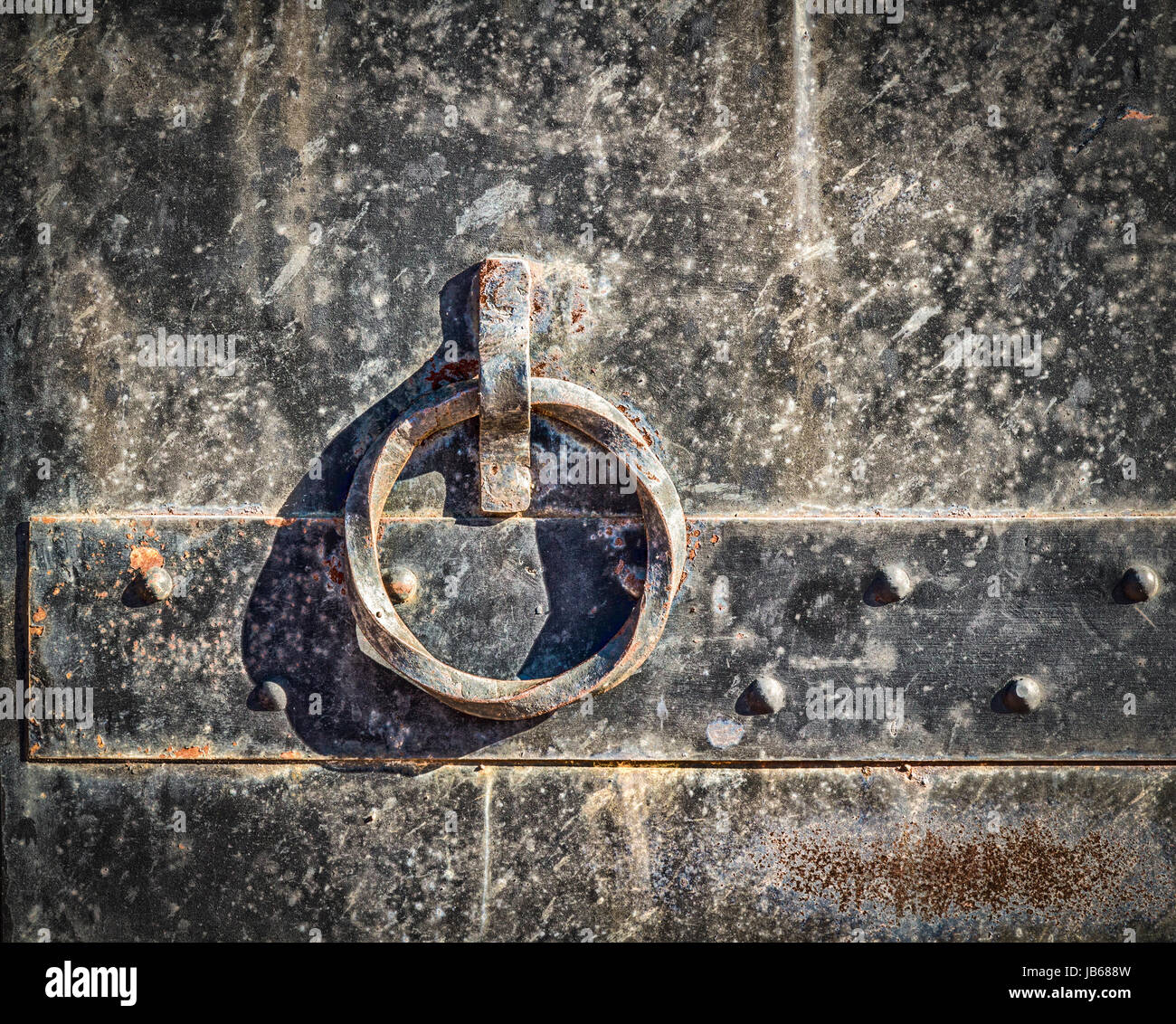 The handle of an old rusty iron door Stock Photo - Alamy