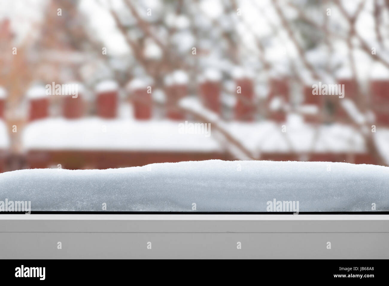 Snow on the window sill Stock Photo - Alamy