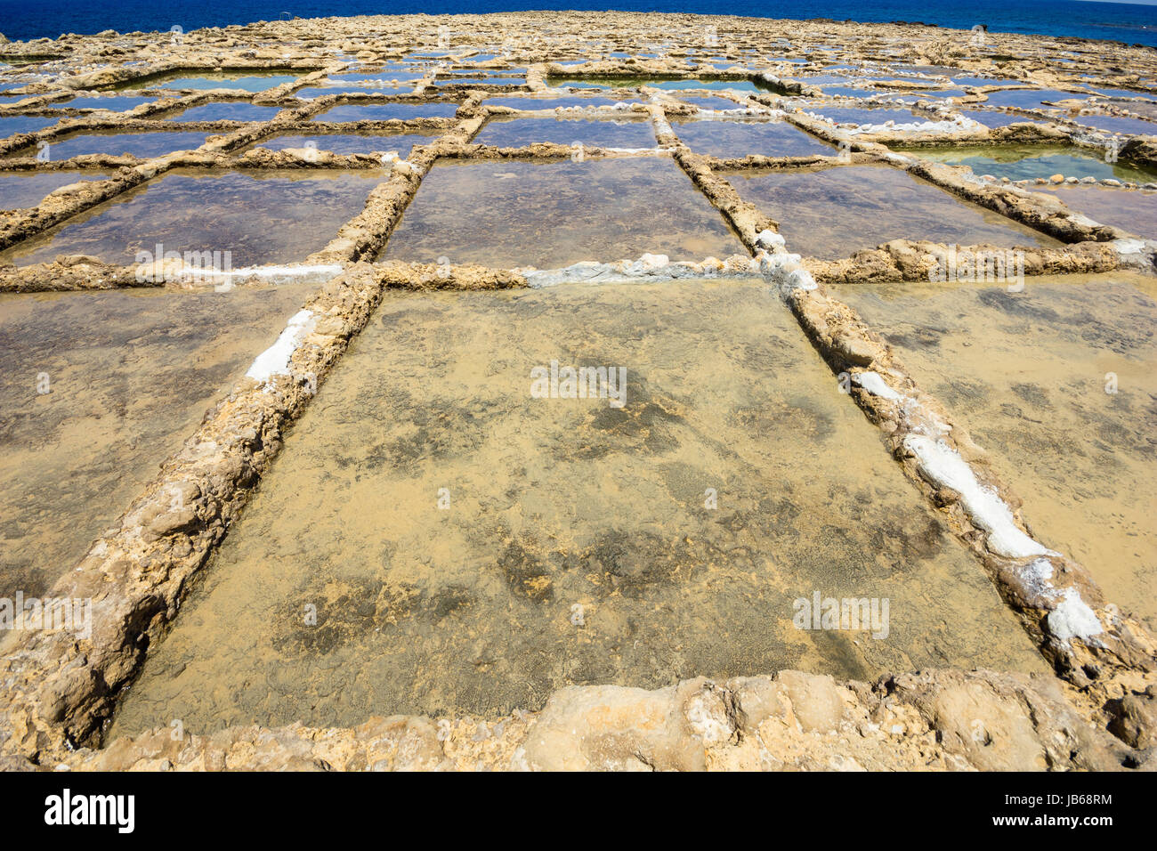 Salt pans used for harvesting sea salt. Xwejni Bay, Gozo island, Malta ...
