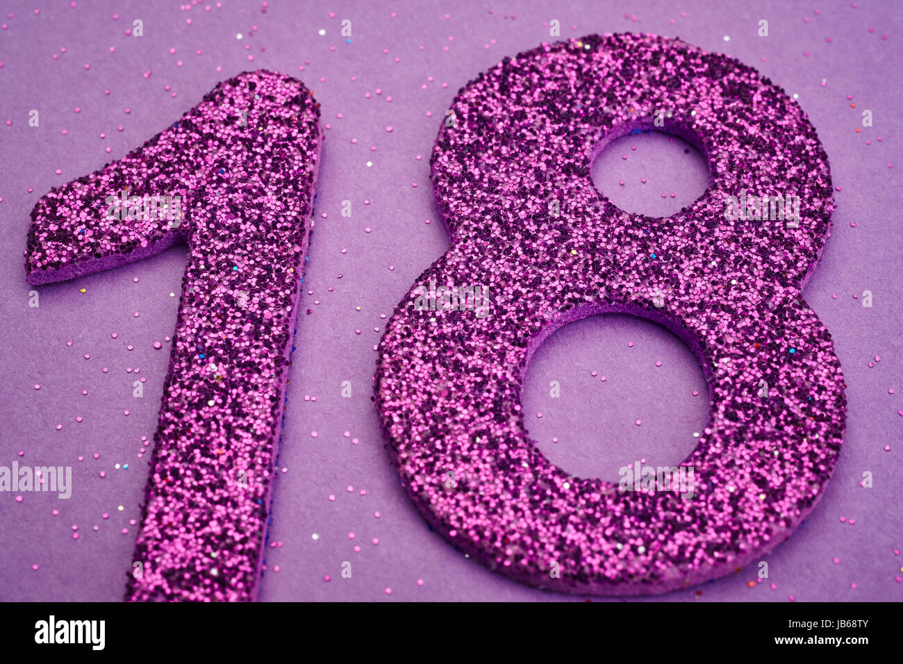 Number eighteen purple color over a purple background. Anniversary ...