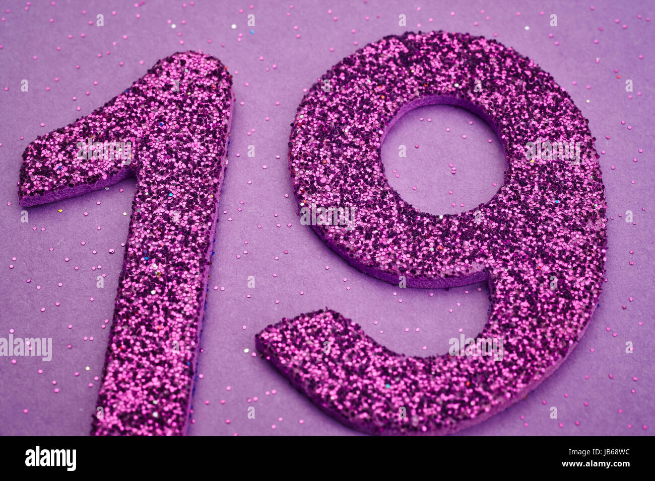 Number nineteen purple color over a purple background. Anniversary ...