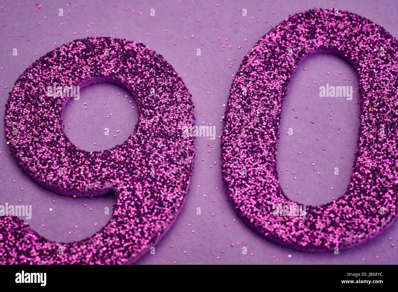 Number ninety purple color over a purple background. Anniversary ...