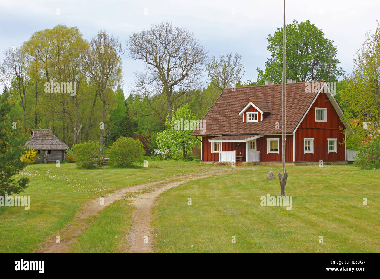 Red House in Landscape Stock Photo - Alamy