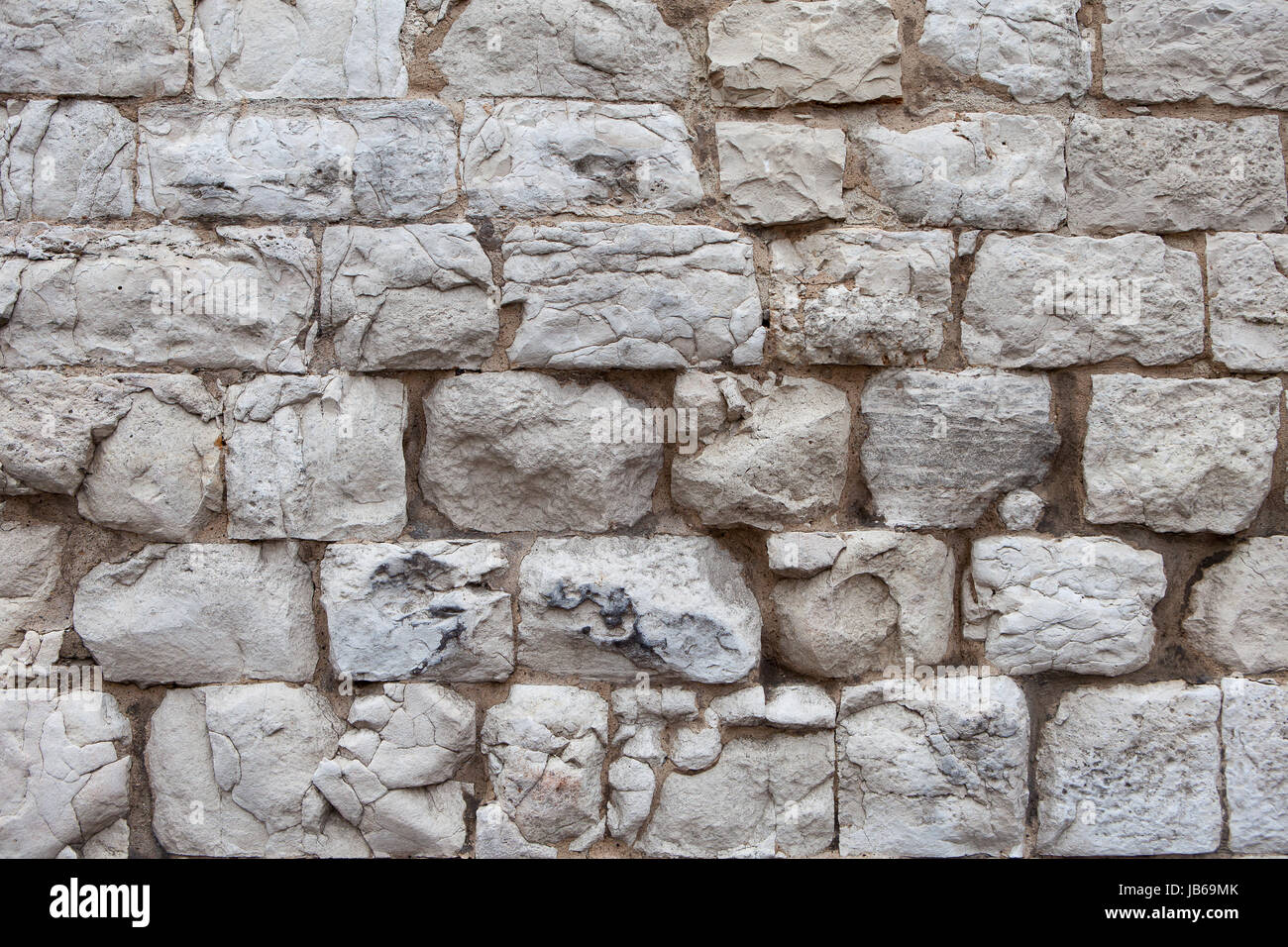 Old wall made of light stones, the masonry background Stock Photo - Alamy