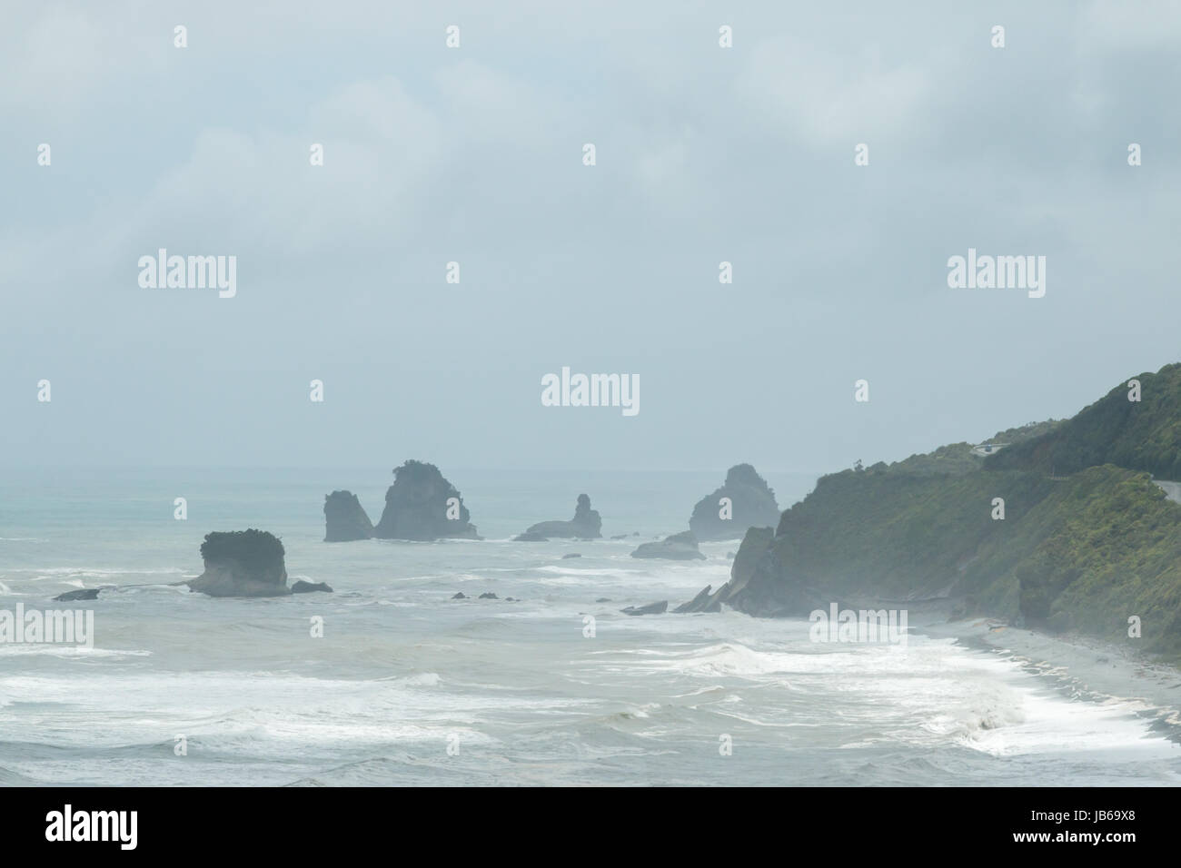 Waves roll in on New Zealand's wild West Coast Stock Photo - Alamy