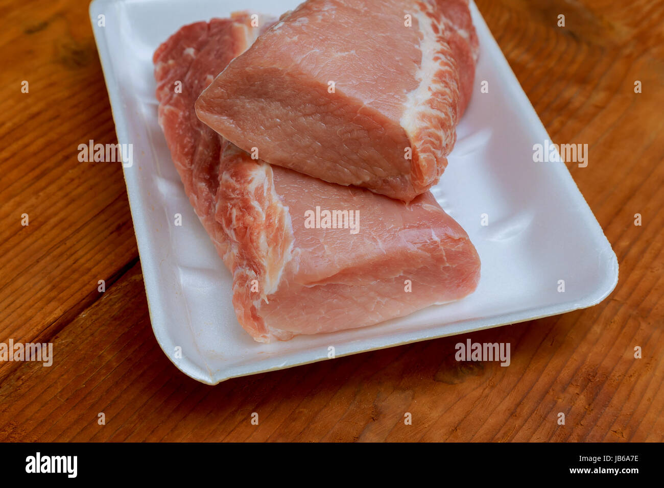 Raw meat pork tenderloin on cutting board ready to cook, pork ...