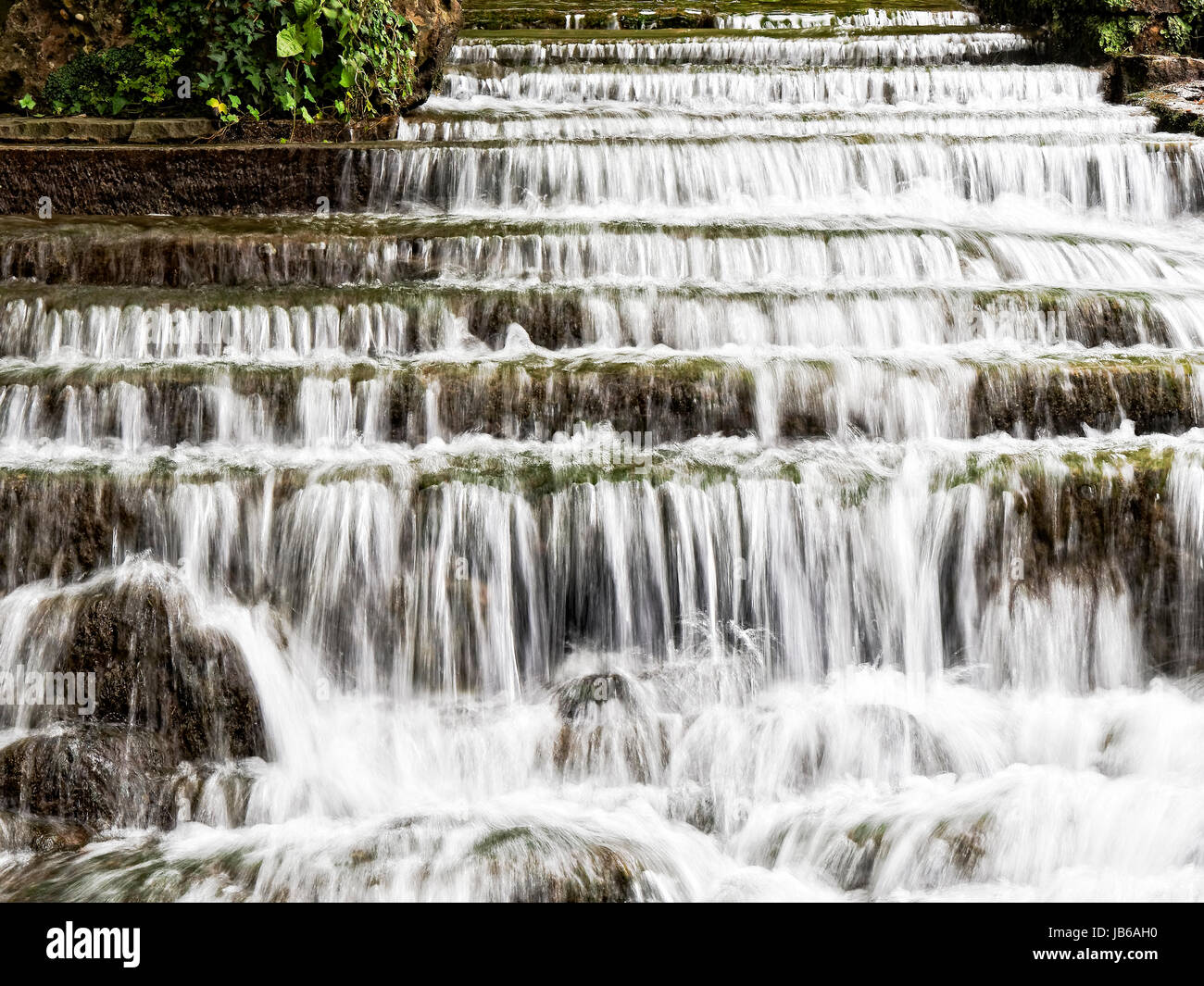 The River Leen tumbles over a waterfall.created by a series of low ...