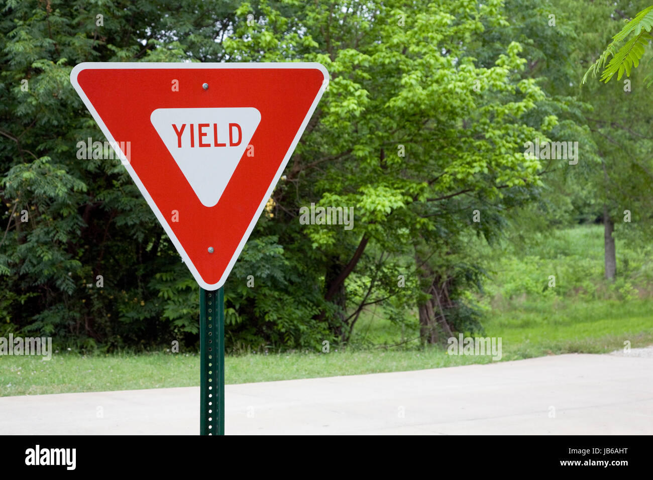 Yield Sign In A Park Stock Photo - Alamy