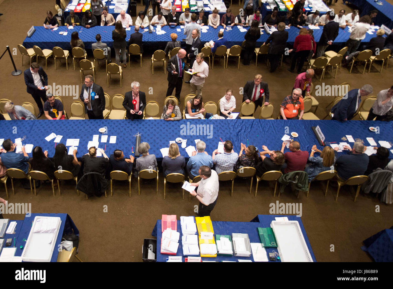 Election staff count ballot papers as a third General Election count ...