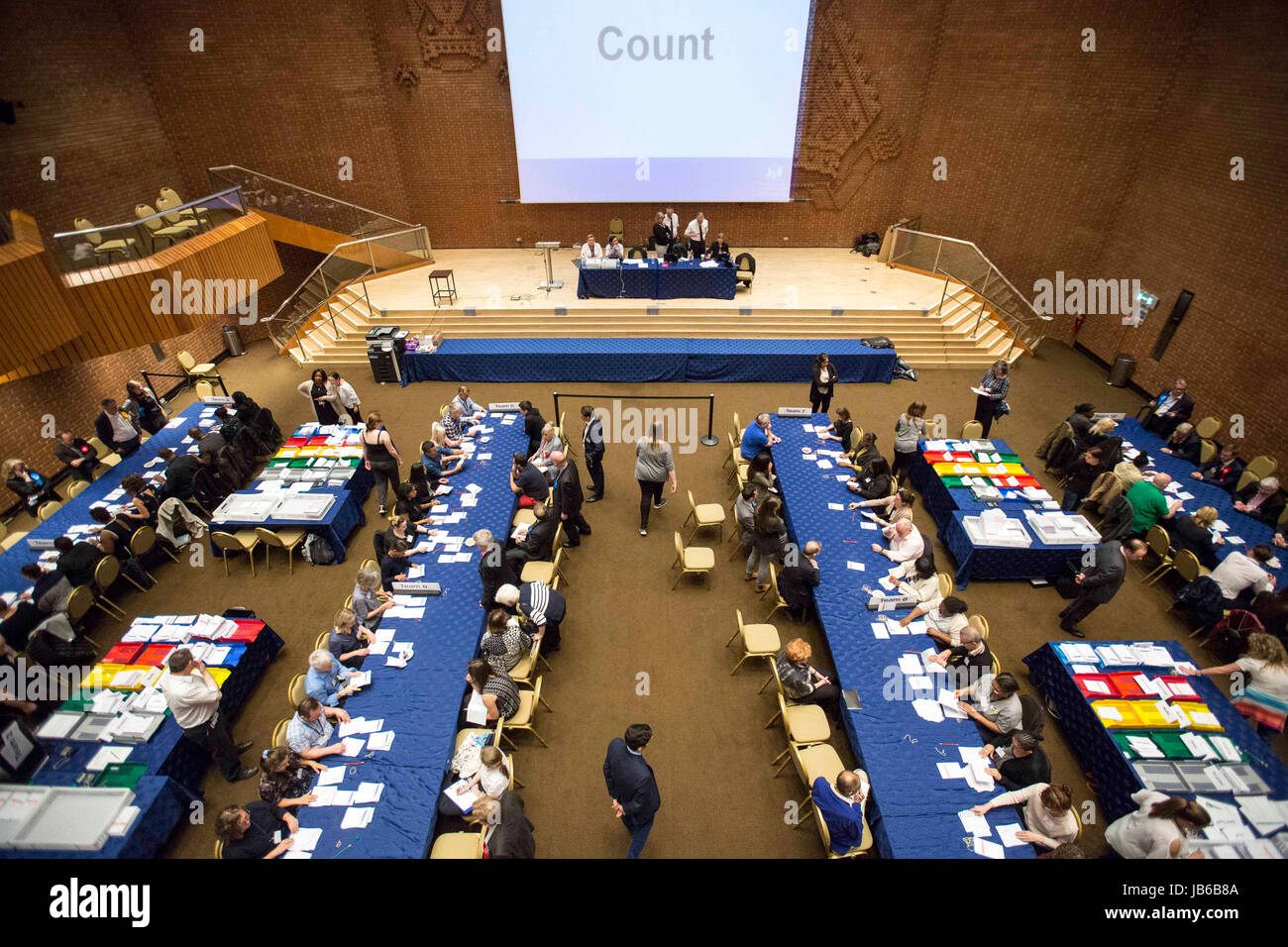 Election staff count ballot papers as a third General Election count ...