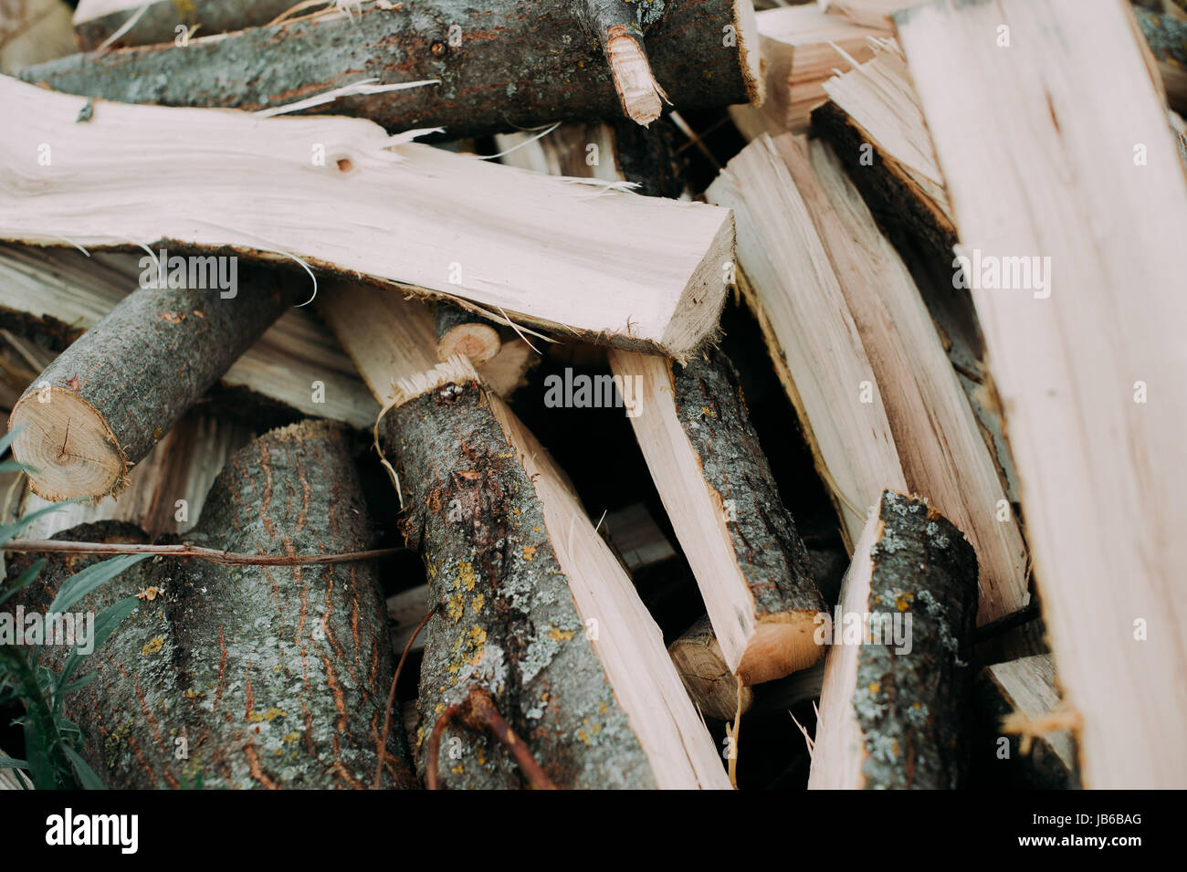 Firewood background - chopped firewood on a stack Stock Photo - Alamy